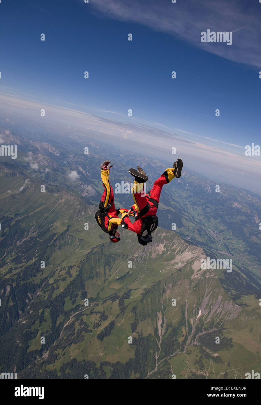 Freefly skydiving team is training formation head down flying over a ...