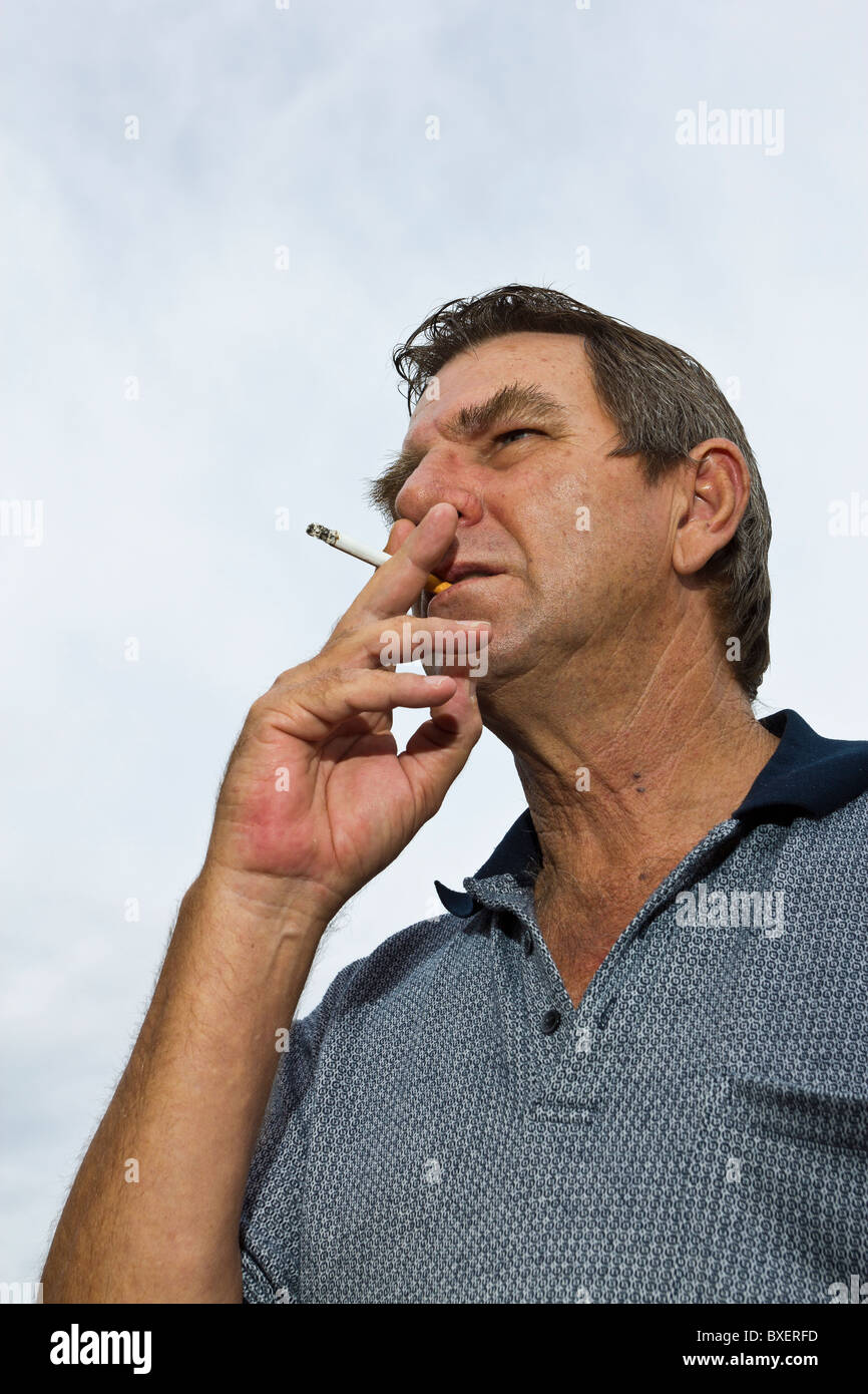 Senior man Smoking Cigarette Stock Photo - Alamy