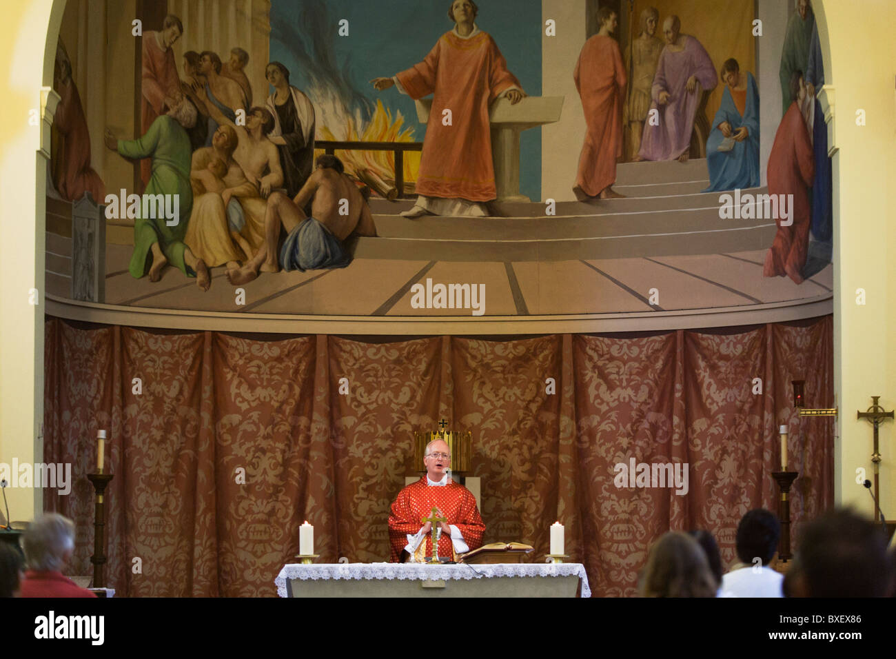 Priest gives blessings during Mass at St. Lawrence's Catholic church in ...