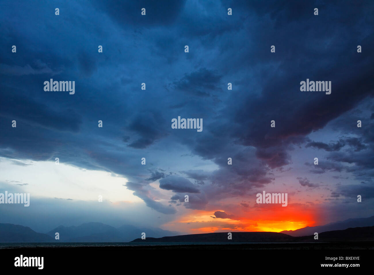 Kyrgyzstan - Toktogul - stormclouds and sunset above mountains at ...