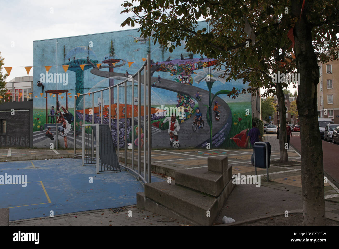 Graffiti on wall in the background, playground in front Stock Photo - Alamy
