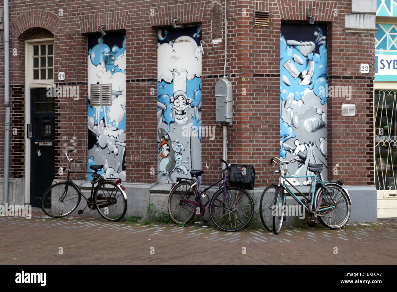Graffiti on windows in Amsterdam Stock Photo - Alamy