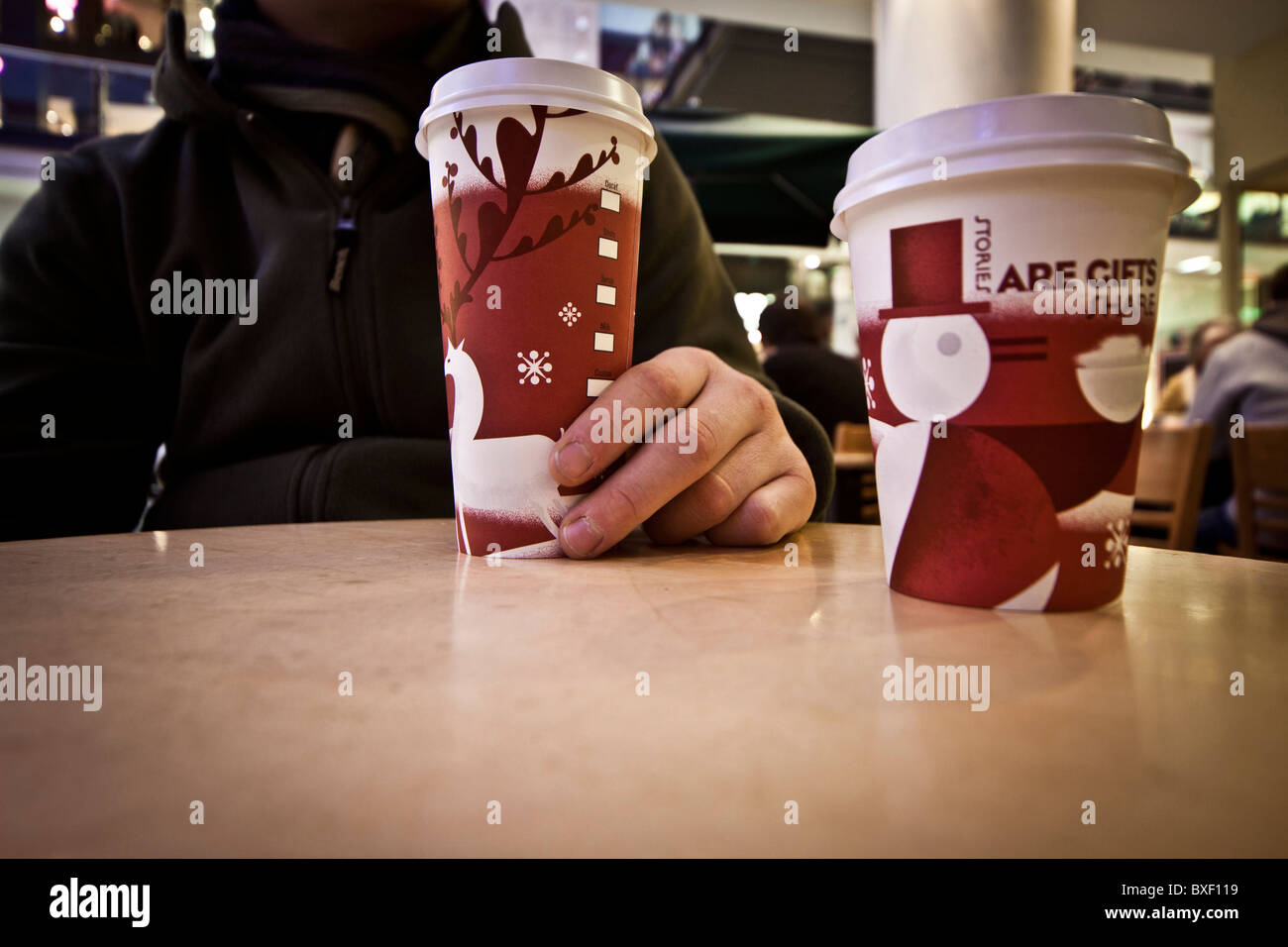 man drinking a hot drink outside Stock Photo - Alamy