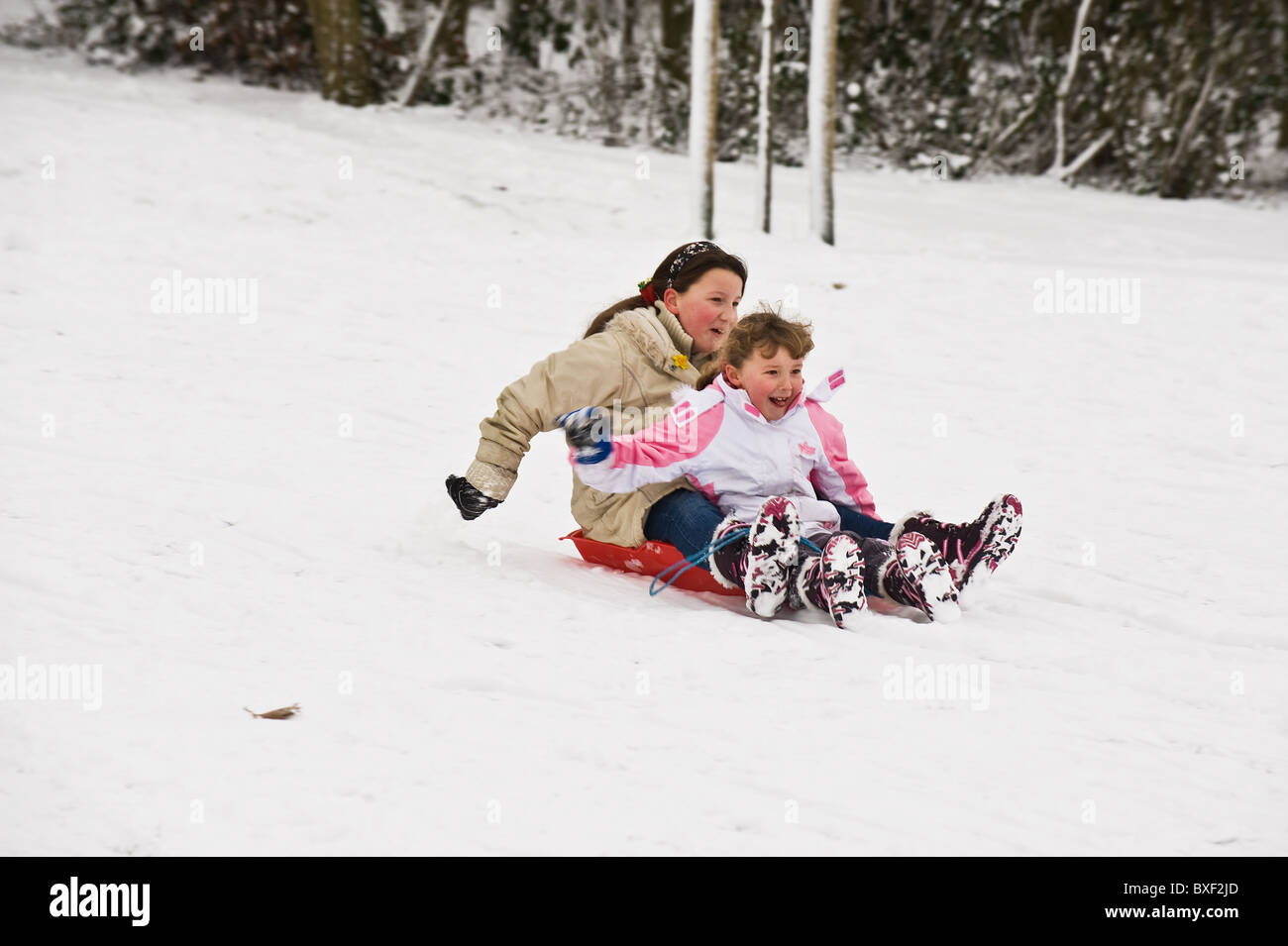 Girls on a toboggan hi-res stock photography and images - Alamy