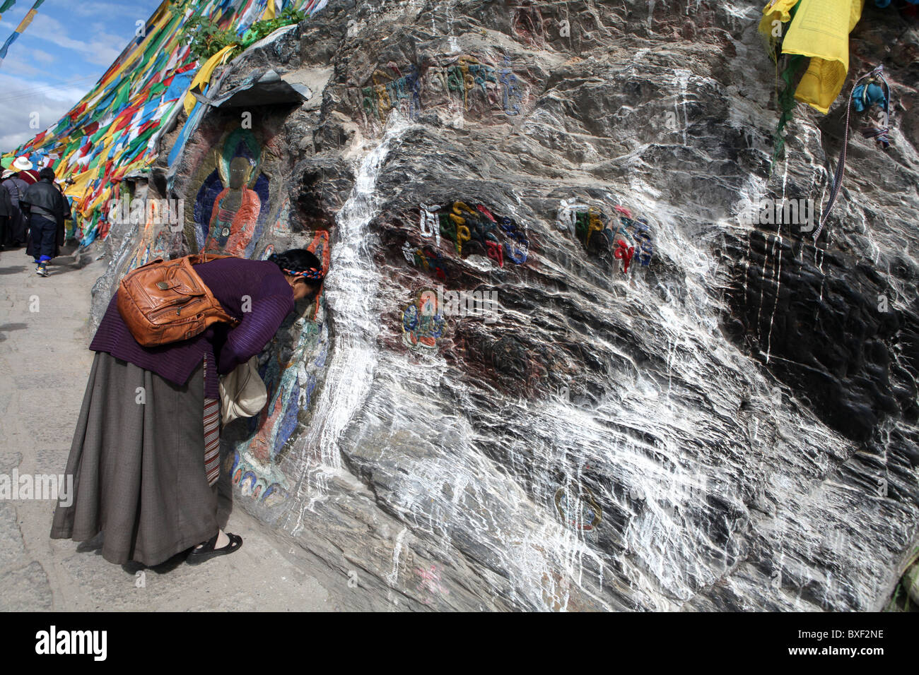 Pilgrims walking the outer pilgrim path or Lingkhor around Iron ...