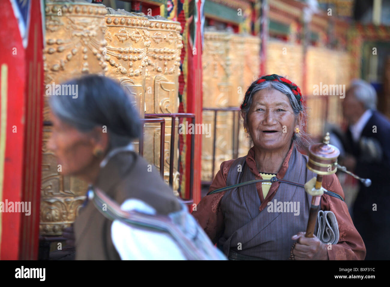 Pilgrims walking the outer pilgrim path or Lingkhor around Iron ...