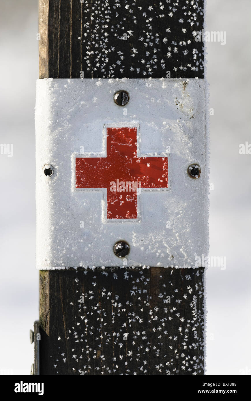 Ice crystals covered red cross sign Stock Photo - Alamy