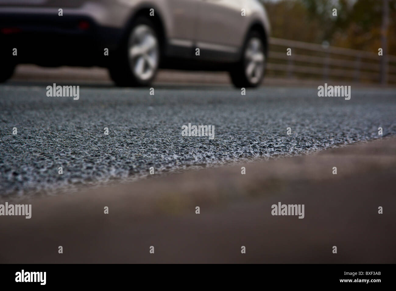Car driving on pavement hi-res stock photography and images - Alamy