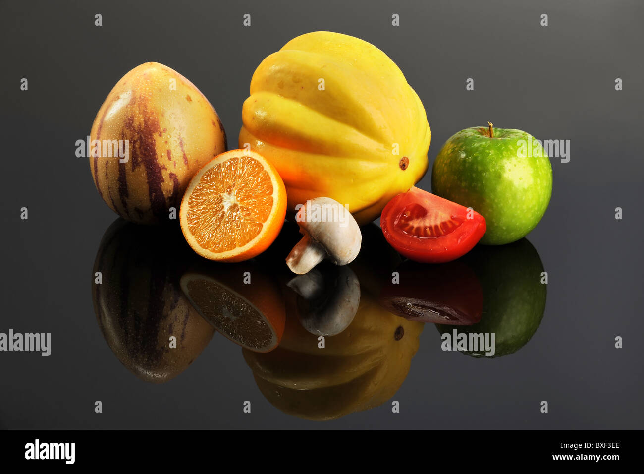 Fresh Fruits and vegetables on reflective table Stock Photo - Alamy