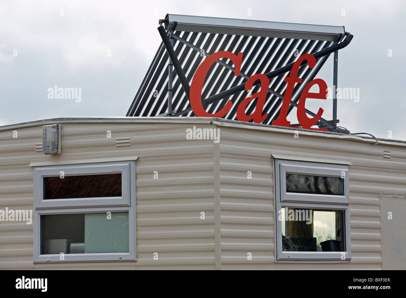 Cafe with solar energy system fitted to the roof Stock Photo - Alamy