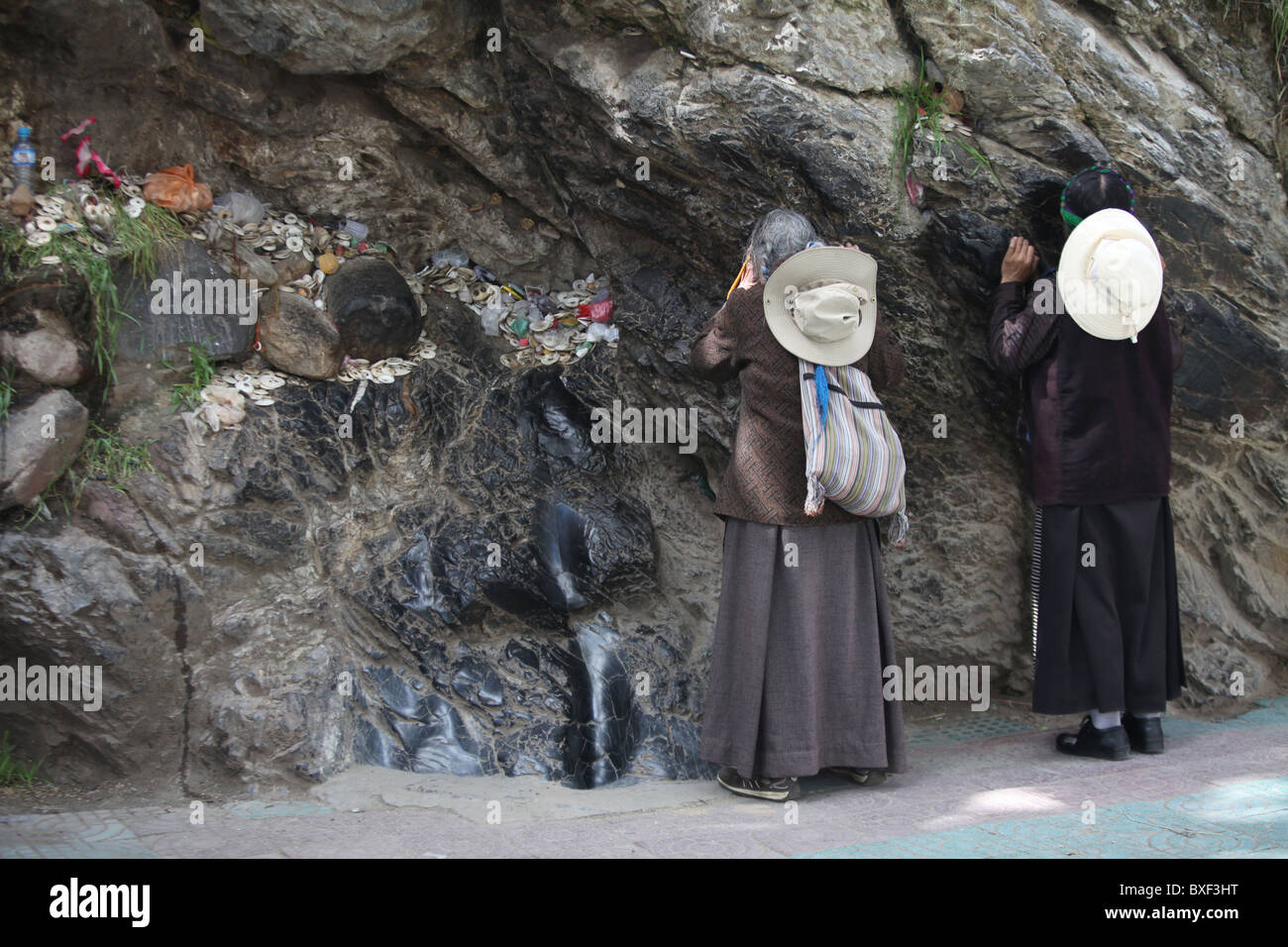 Pilgrims walking the outer pilgrim path or Lingkhor around Iron ...