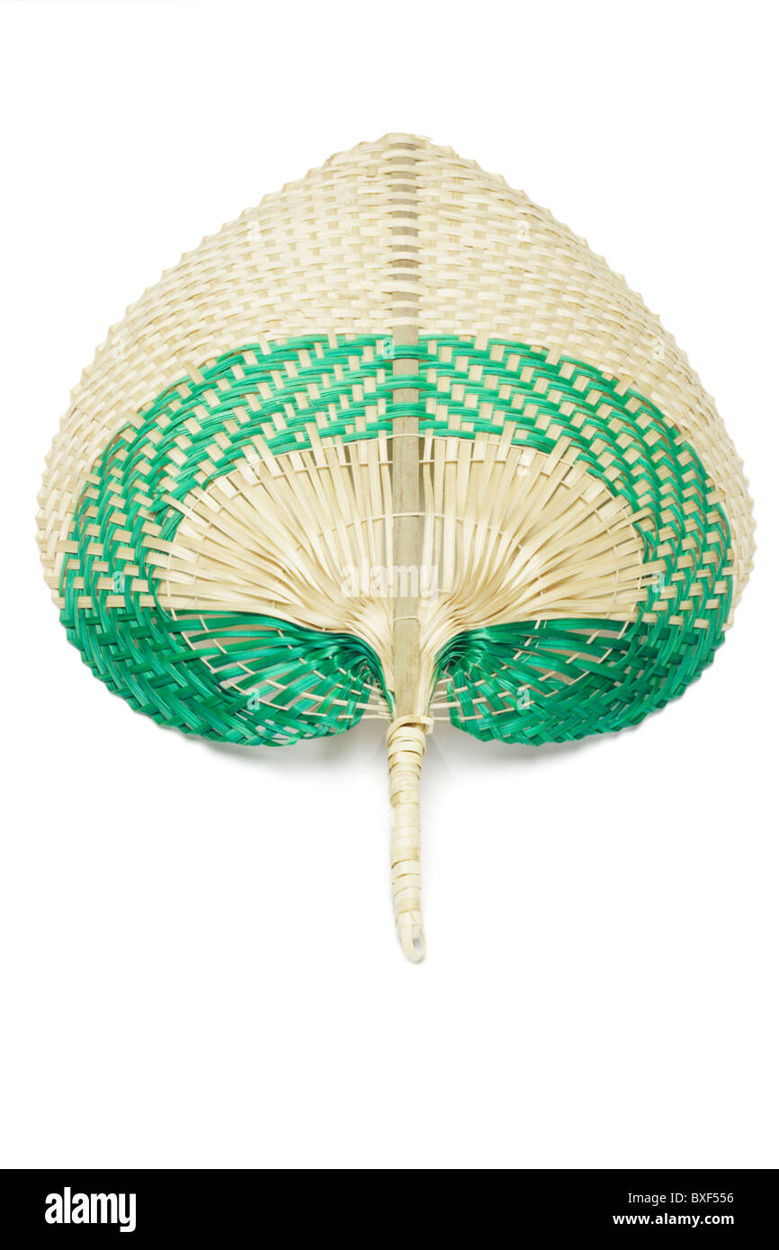 Hand held straw fan on white background Stock Photo - Alamy