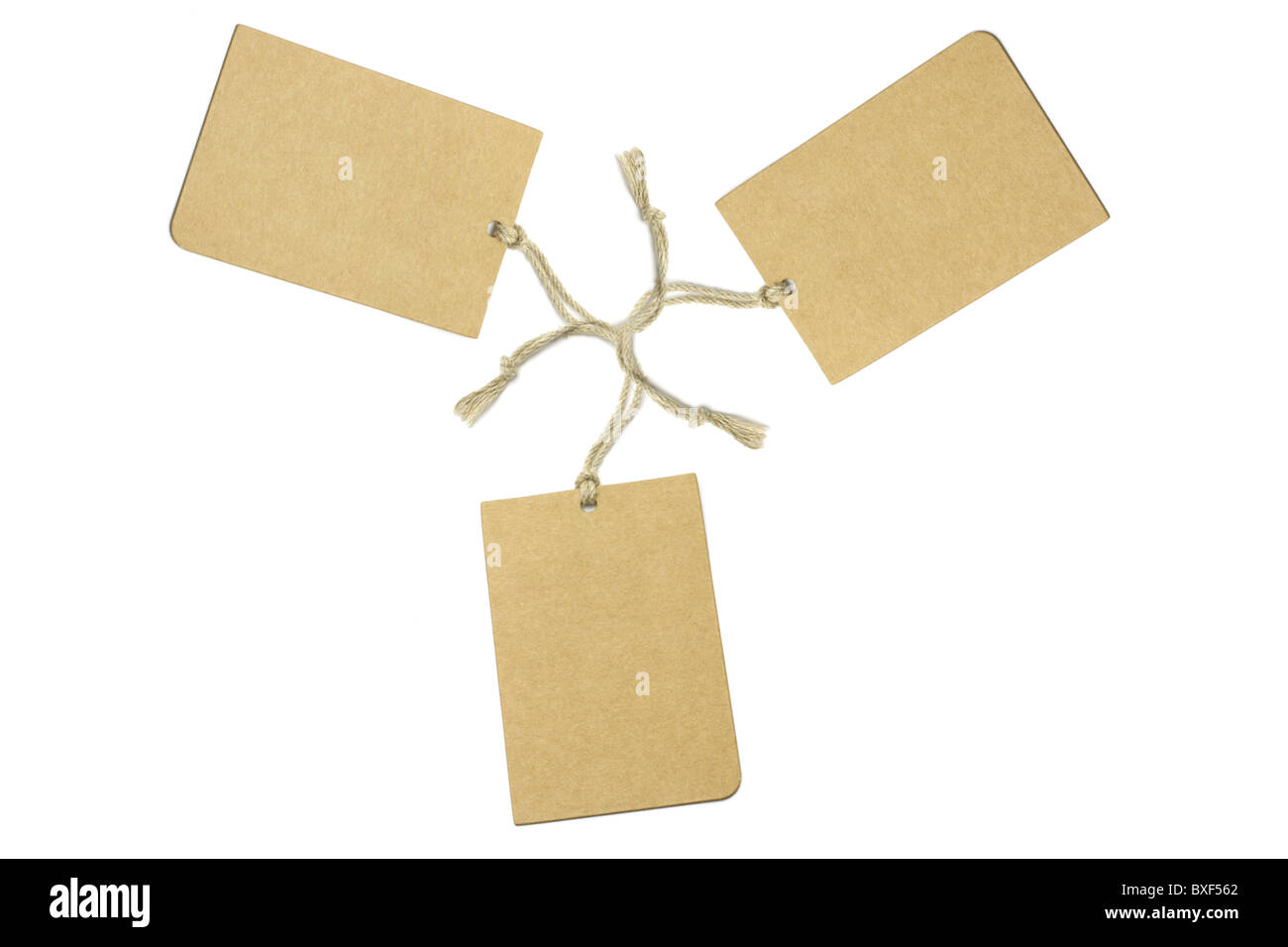 Three brown tags arranged on white background Stock Photo - Alamy