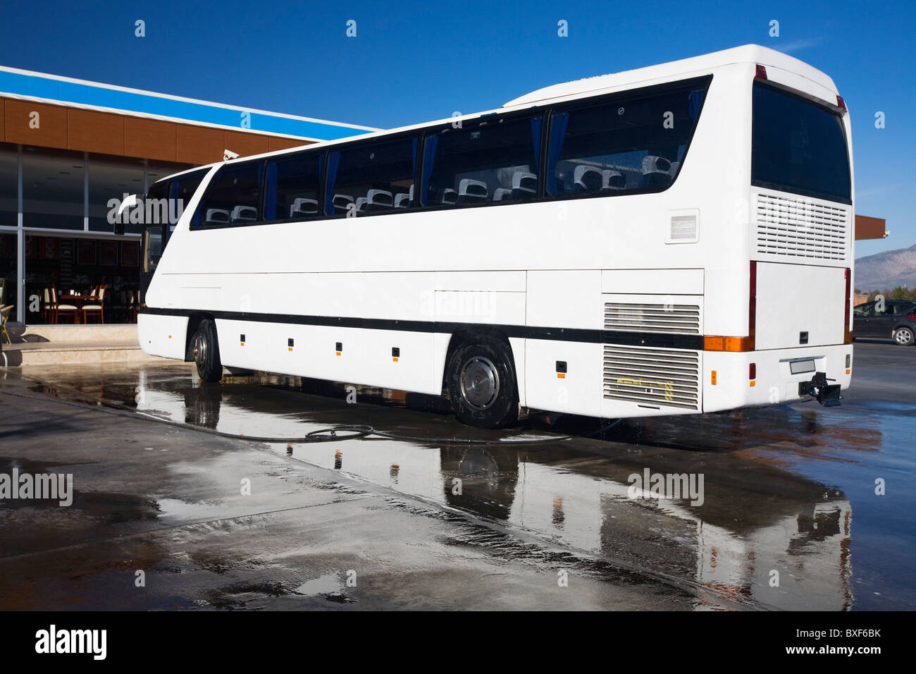 White tourist bus parked outside restaurant, Turkey Stock Photo - Alamy