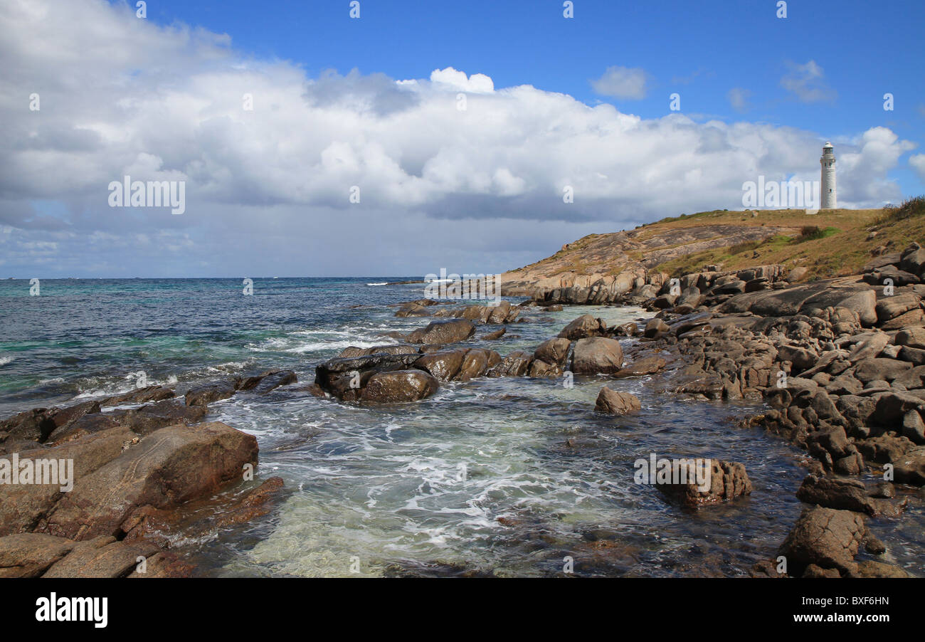 White lighthouse and rocks Stock Photo - Alamy