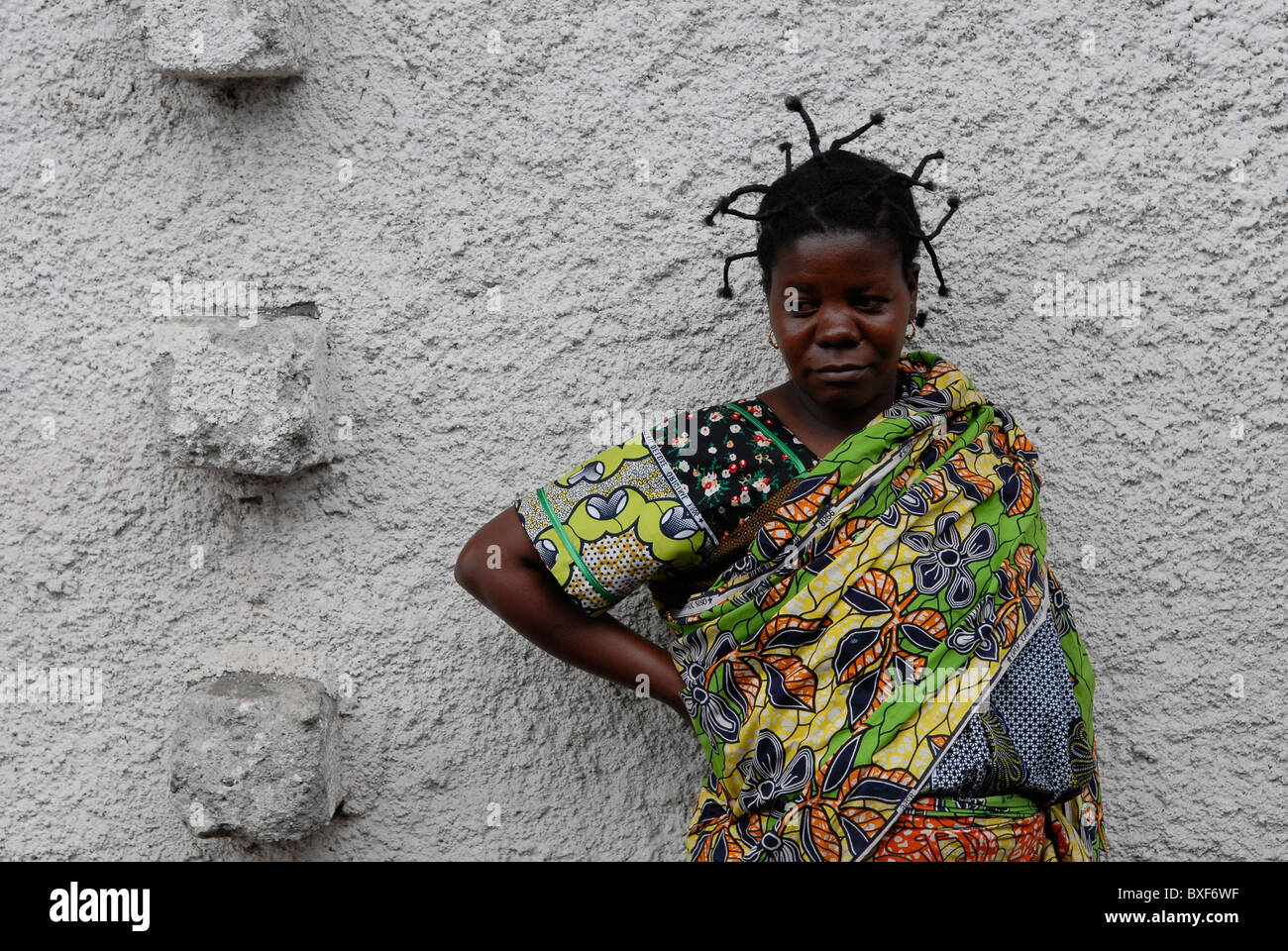 A woman with a traditional threading hairstyle wherein the hair is ...