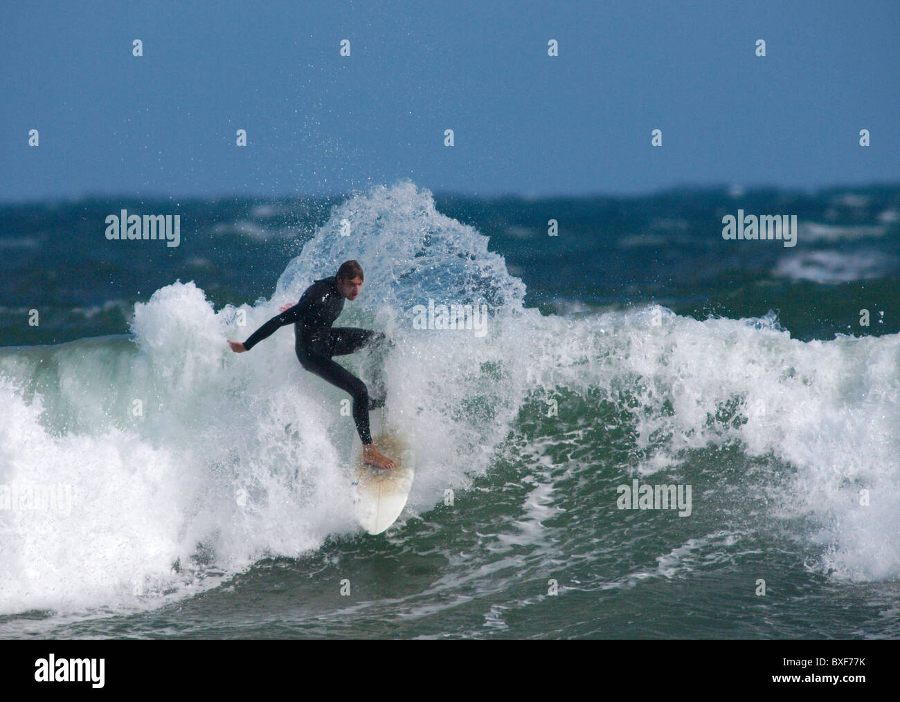 LONE MALE SURFER RIDING WAVES AND DOING TRICKS, TORQUAY, VICTORIA ...