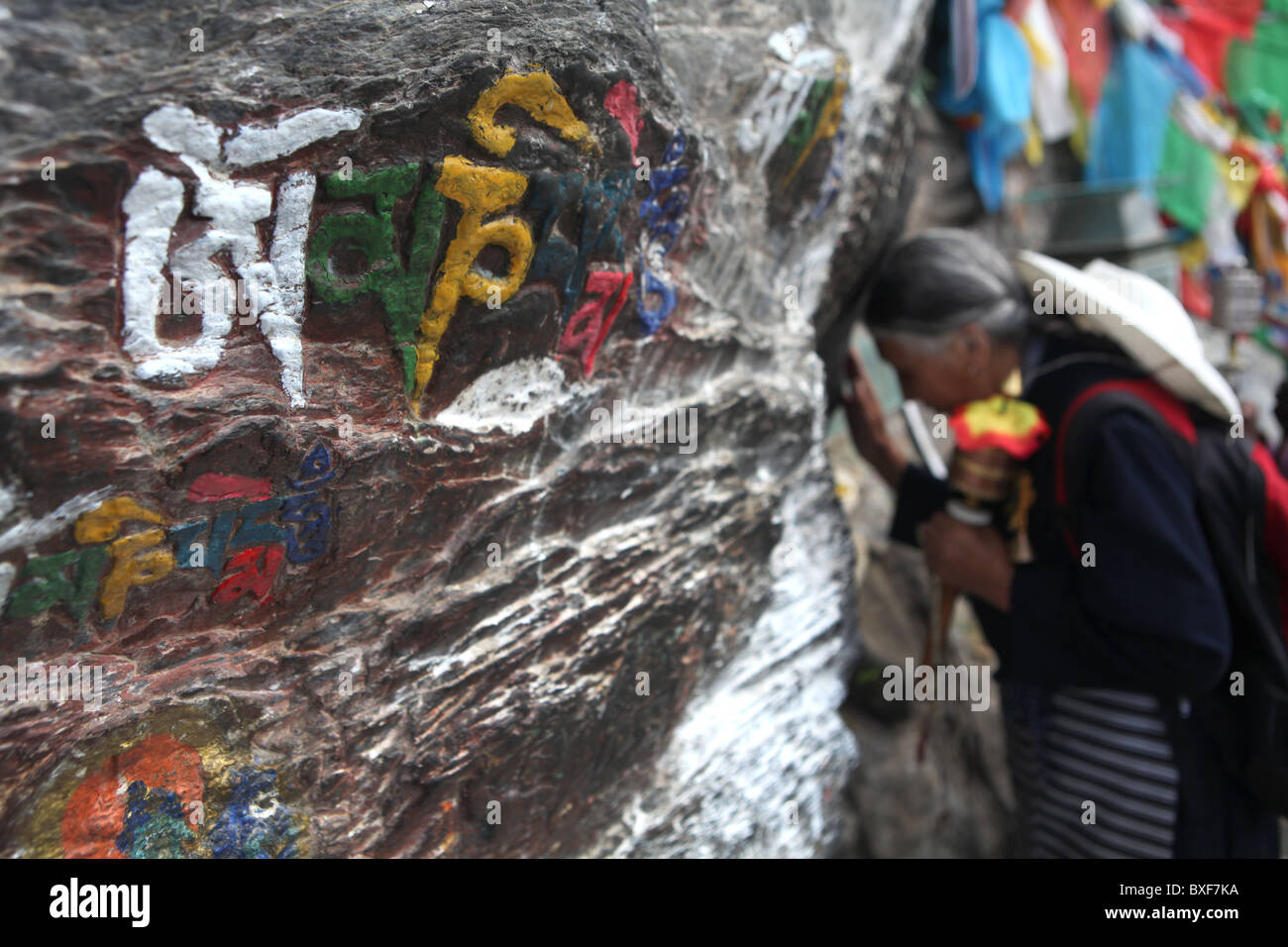 A pilgrim walking the outer pilgrim path or Lingkhor around Iron ...