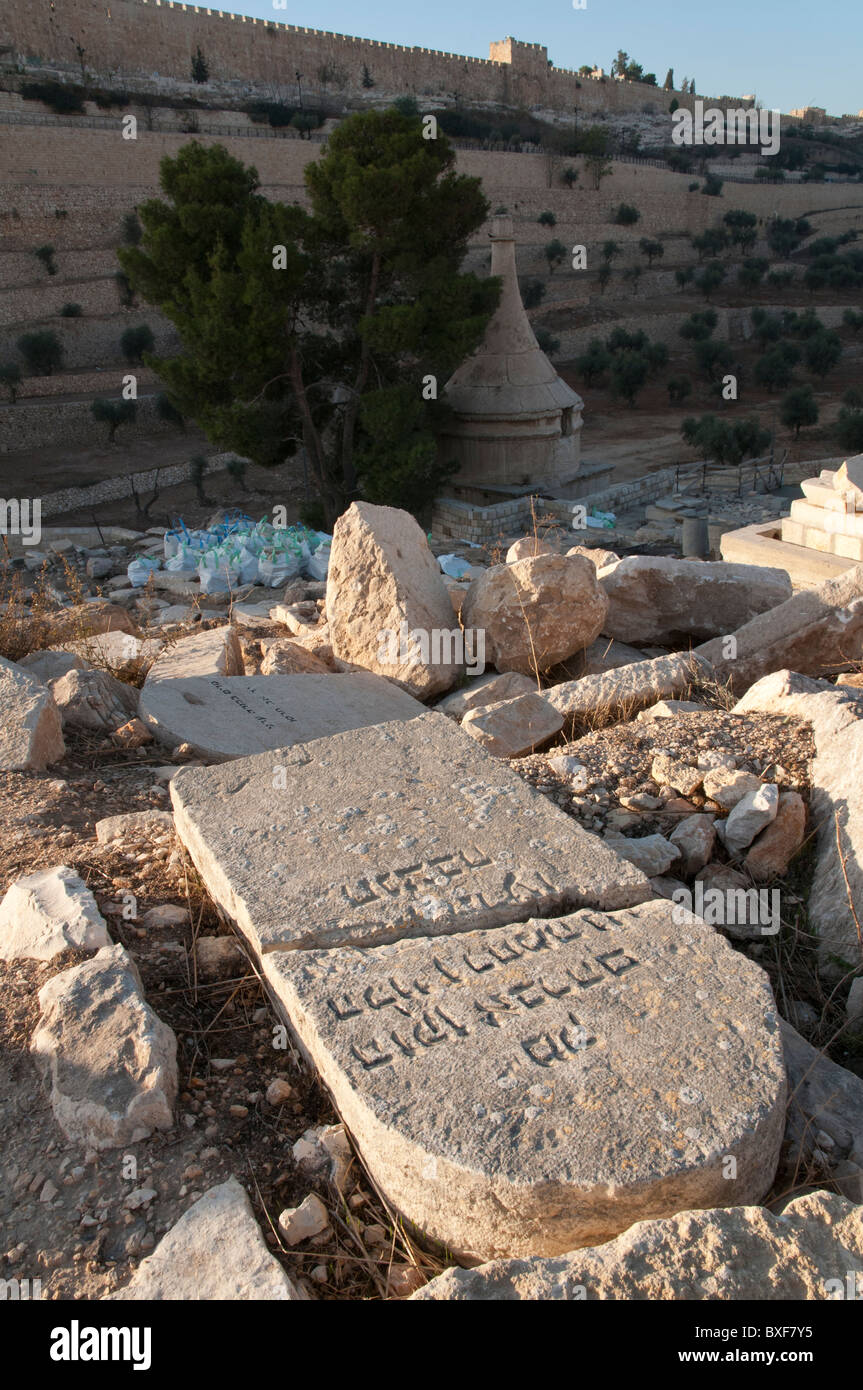 Old gravestone with hebrew writings at mount of Olives with old city ...