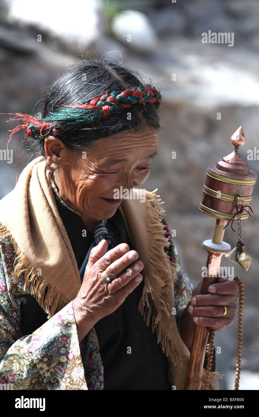 Pilgrims walking the outer pilgrim path or Lingkhor around Iron ...