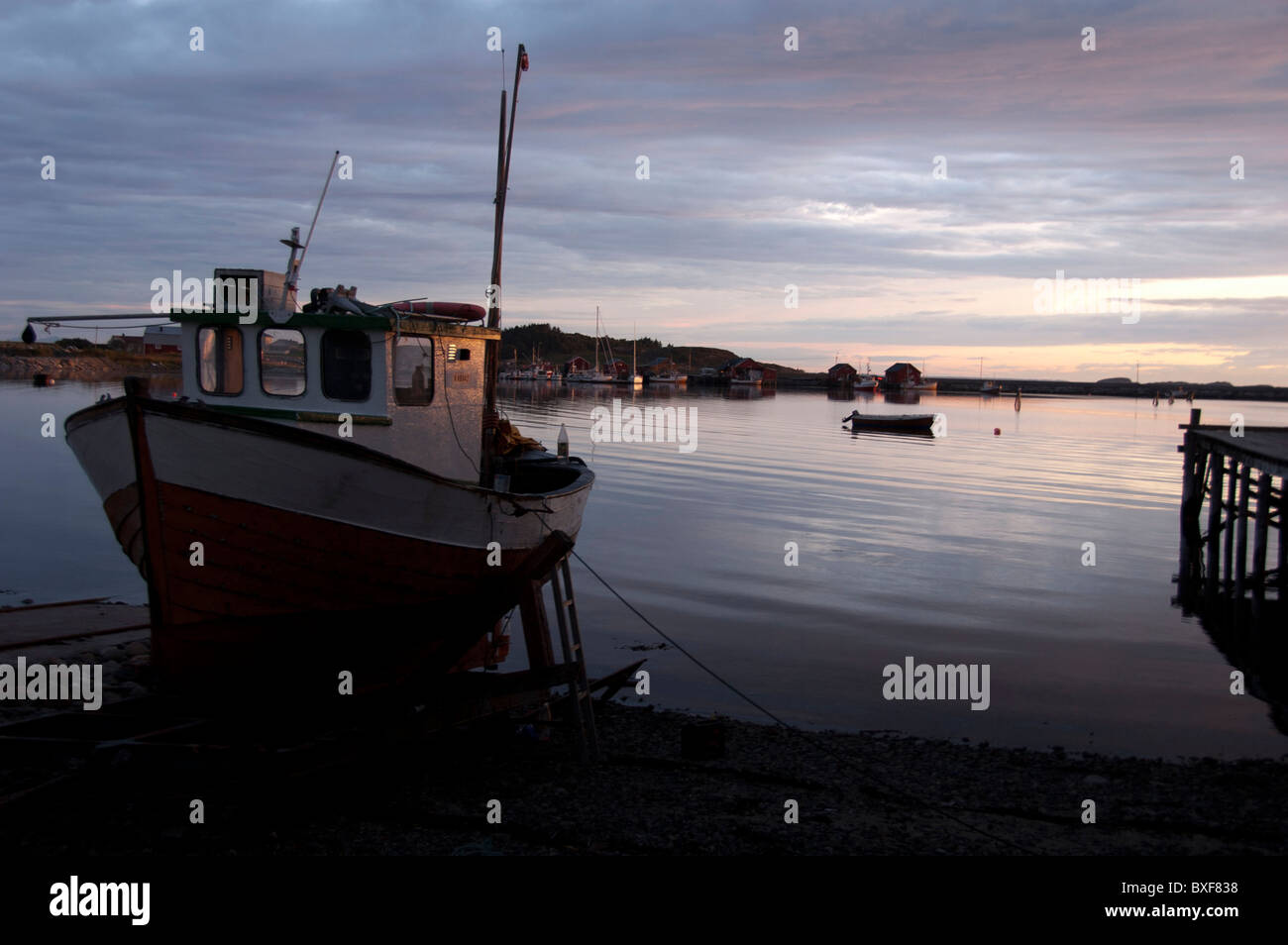 A fishing boat in a Norwegian harbor Stock Photo - Alamy