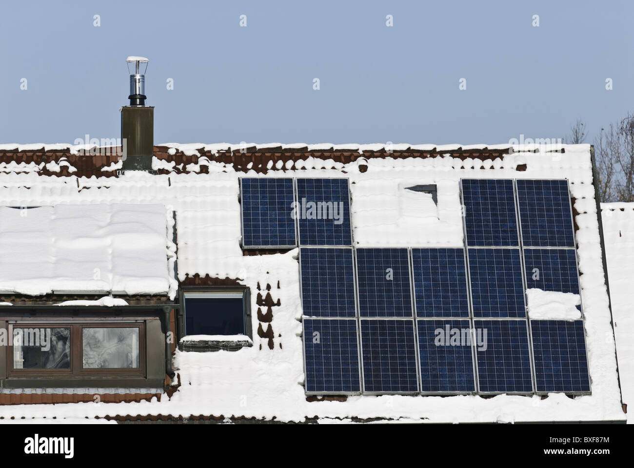 Snow covered rooftop solar panels Stock Photo - Alamy