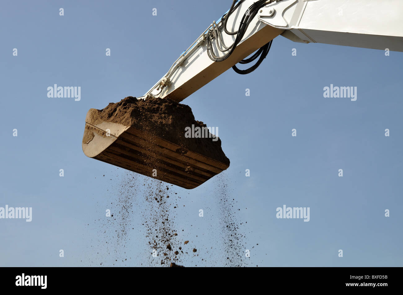 Huge crane elevating sand Stock Photo - Alamy