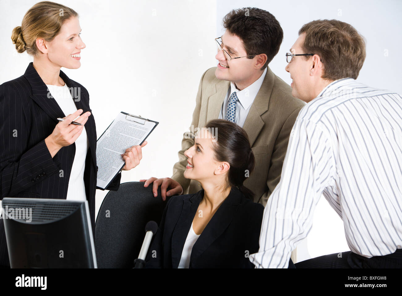 Photo of successful professionals interacting with each other Stock ...