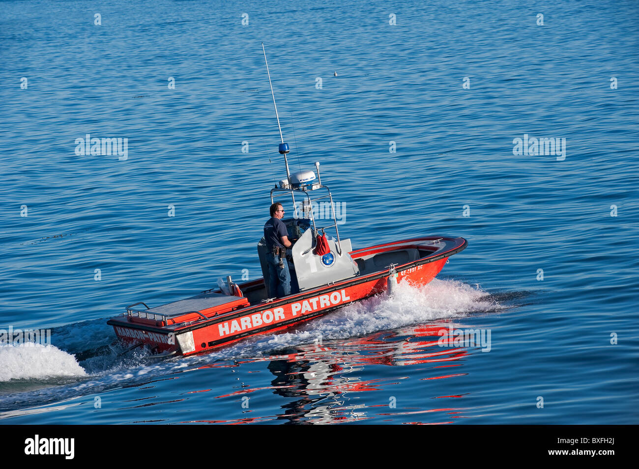 An harbor patrol speed boat on a patrol at east beach, santa barbara ...