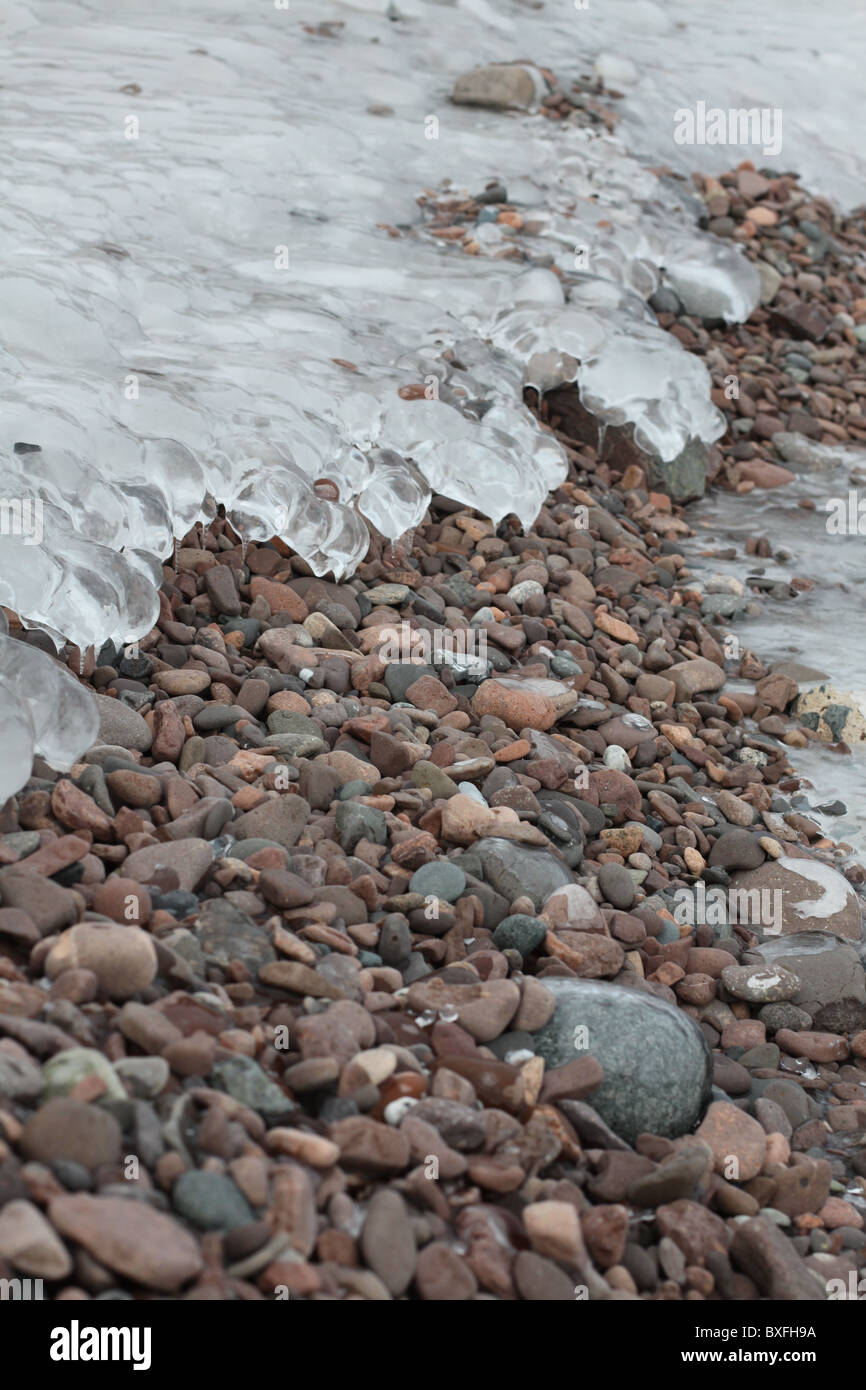 Ice covered pebbles on a beach in Lake Superior Stock Photo - Alamy