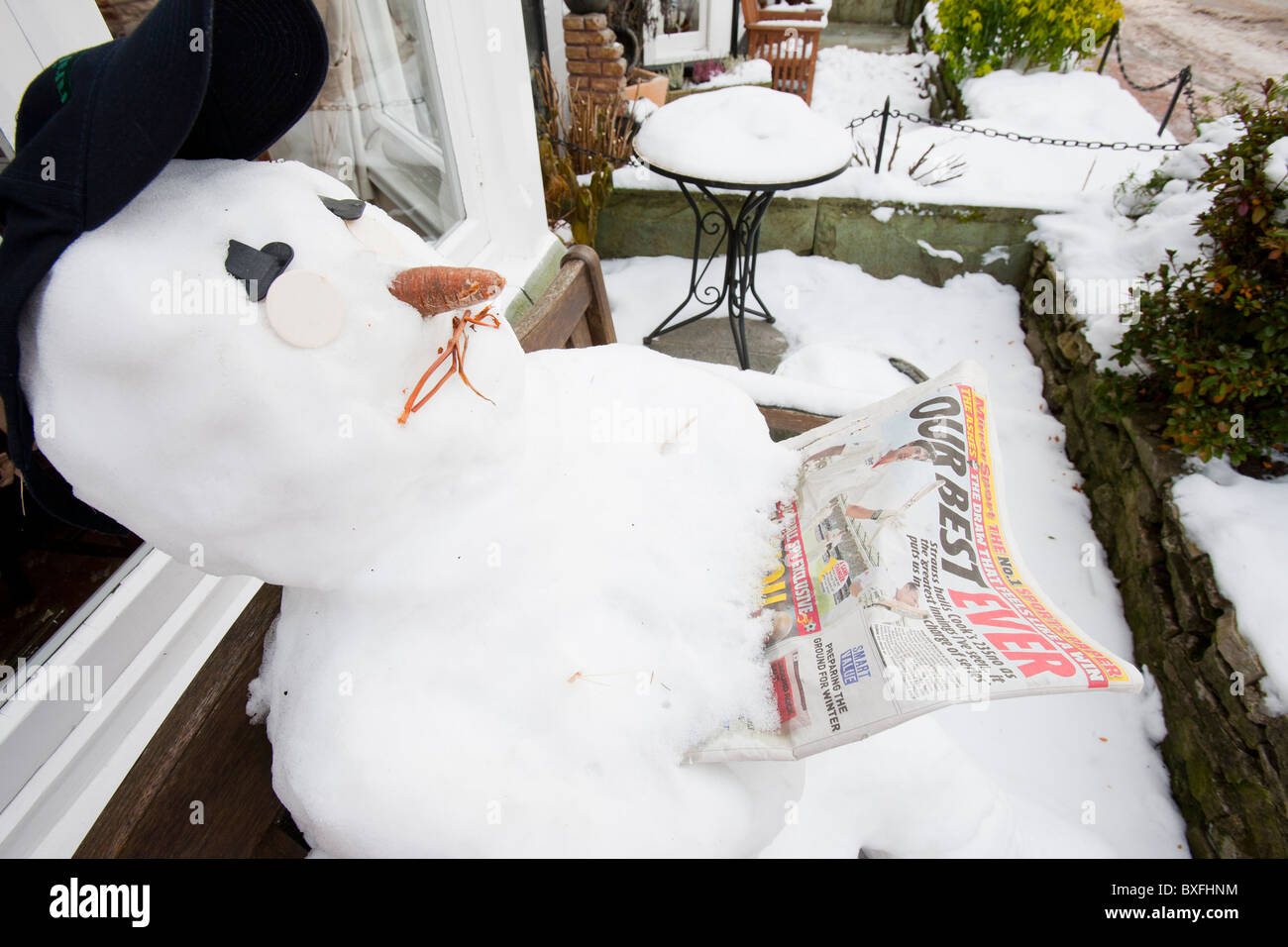A snowman reading the paper, Ambleside, Lake District, UK Stock Photo ...