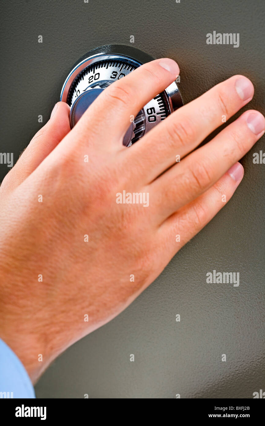 Male hand picking a combination lock on the safe Stock Photo - Alamy