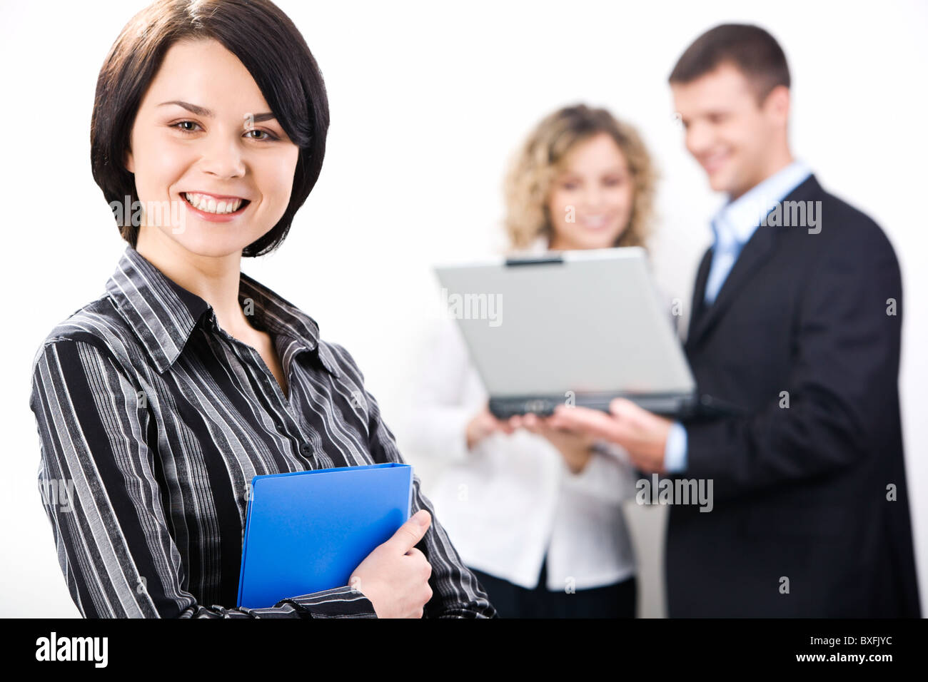 Portrait of attractive consultant with friendly smile on the background ...