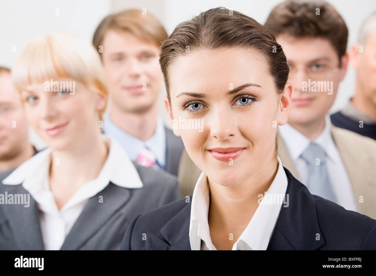 Photo of female leader with her business team Stock Photo - Alamy