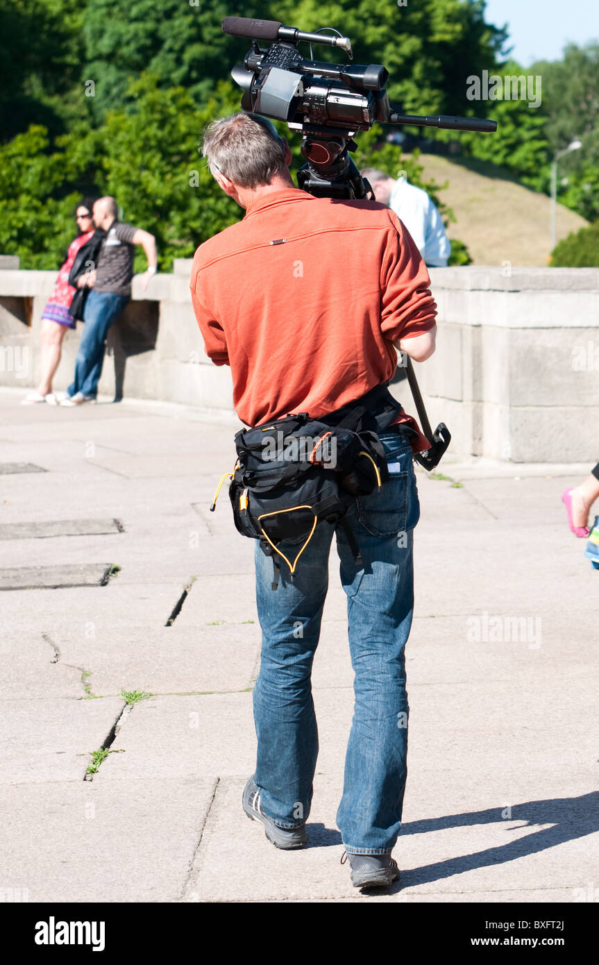 man with the video camera Stock Photo - Alamy