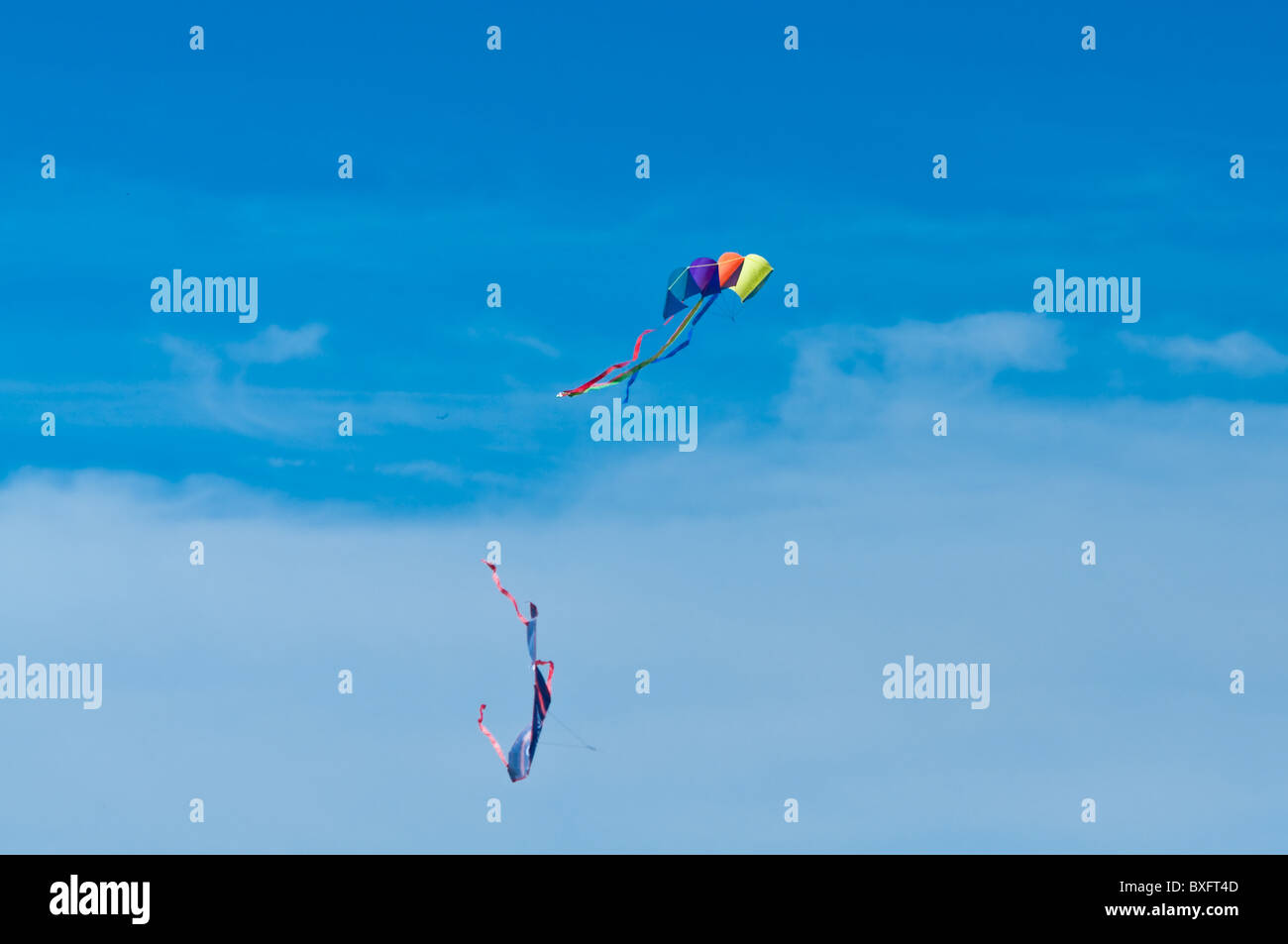 colorful kite with ribbon flying in the air Stock Photo - Alamy
