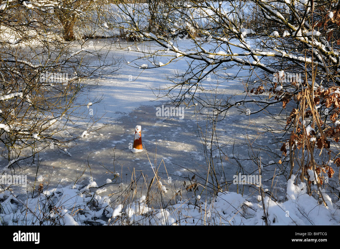 ice on frozen pond Stock Photo - Alamy