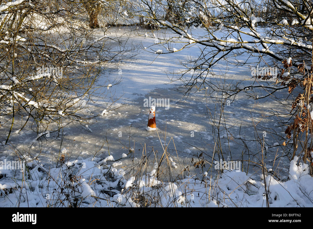ice on frozen pond Stock Photo - Alamy