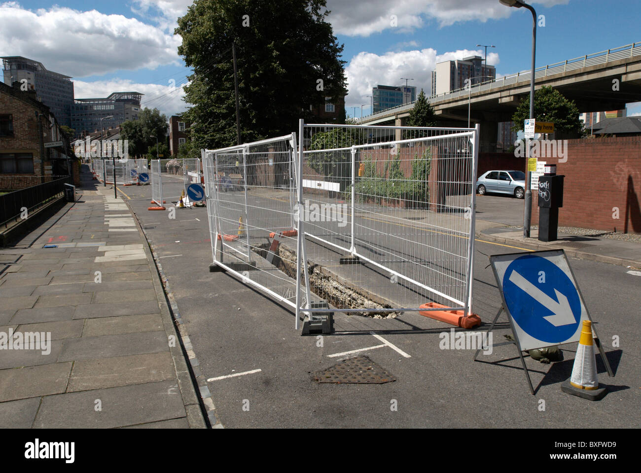 Waterworks on a road London UK Stock Photo - Alamy