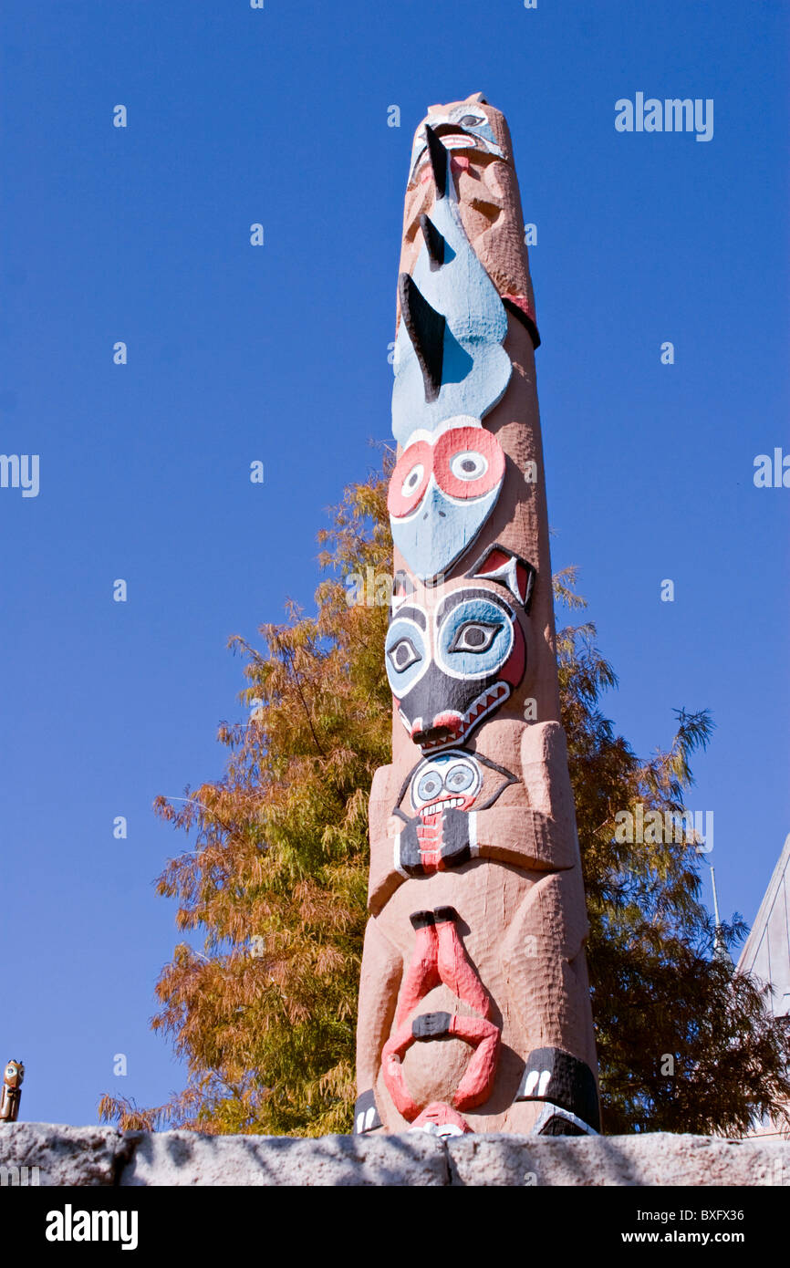 Carved monumental Totem Pole usually created as Pacific Northwest cared ...