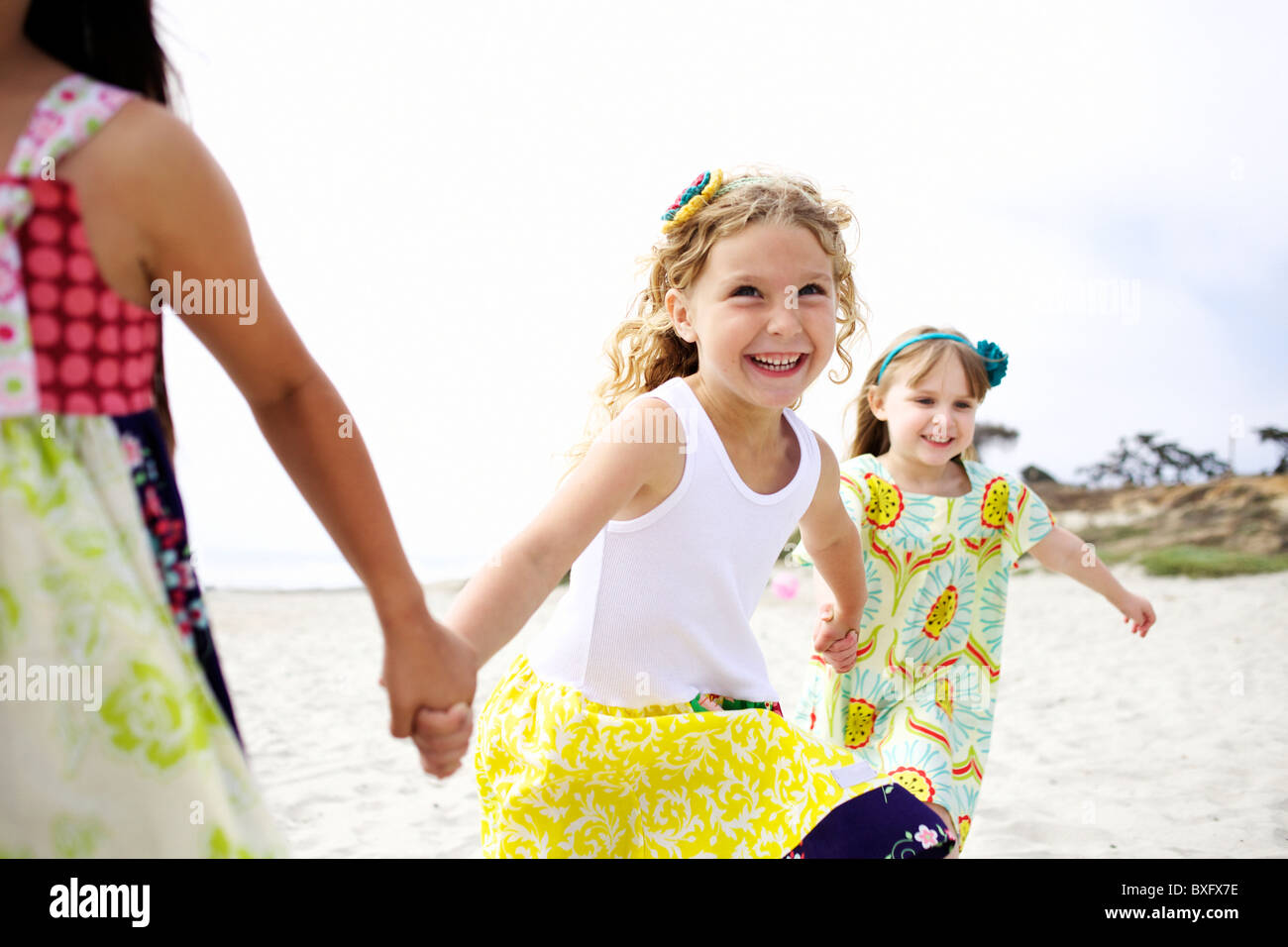 Children holding hands playing hi-res stock photography and images - Alamy
