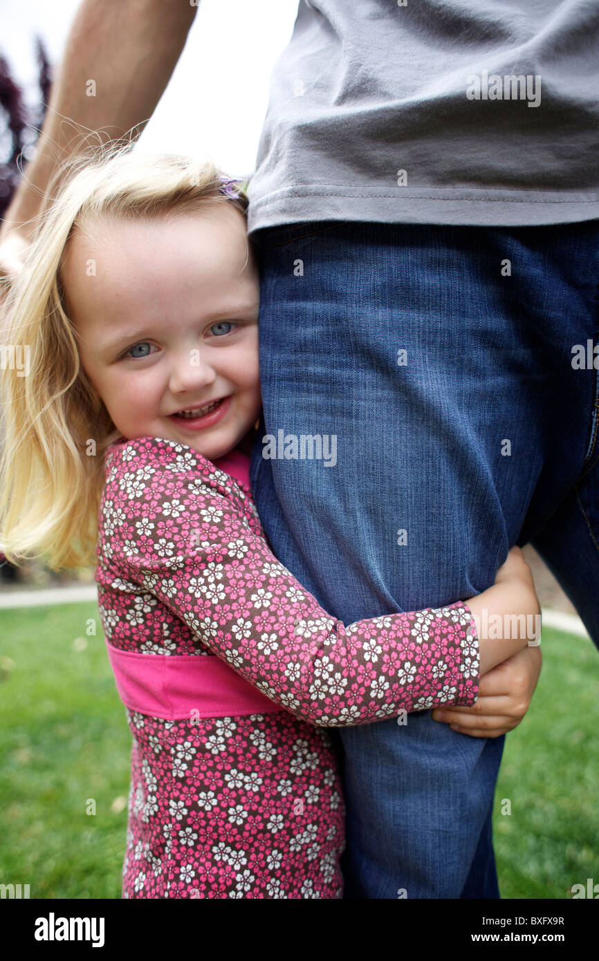 Child hugging leg hi-res stock photography and images - Alamy