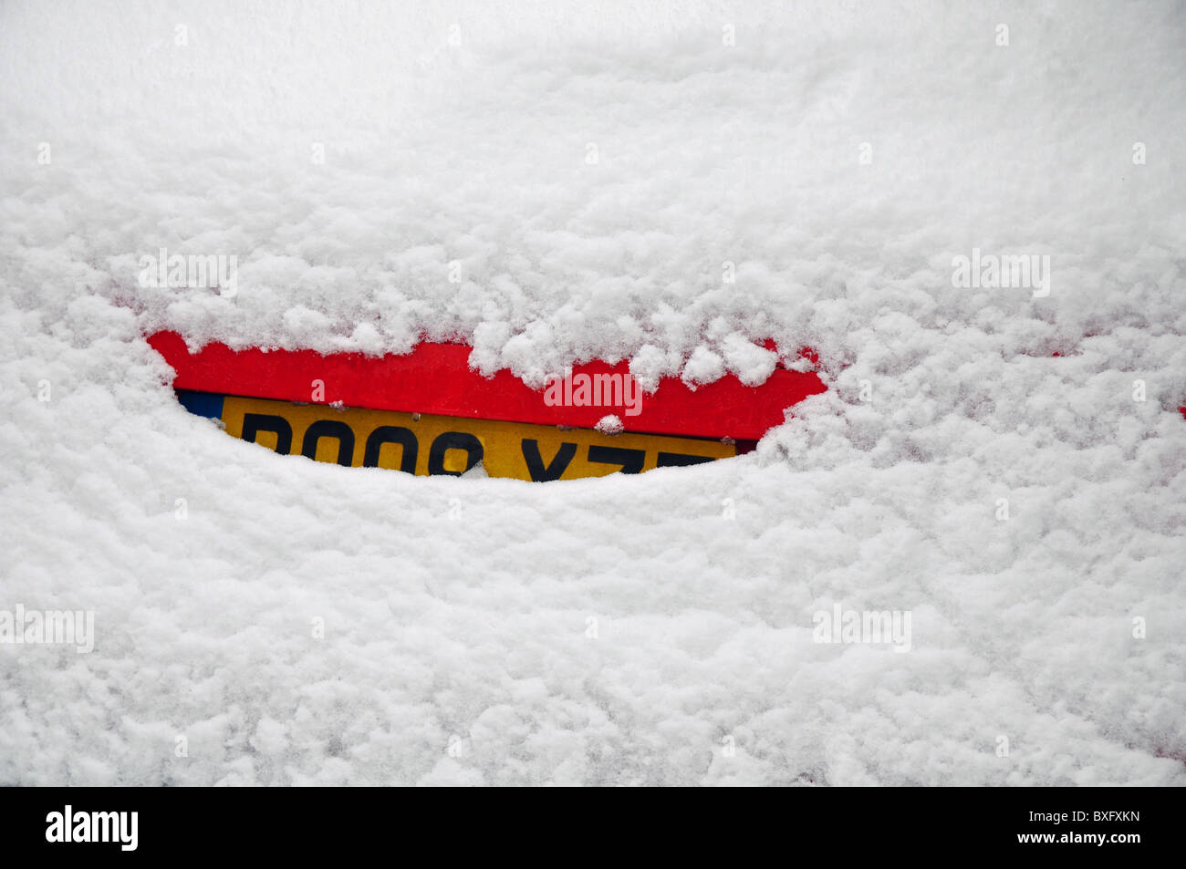 Ascot, Berkshire, England: snow covered car with license plate just ...