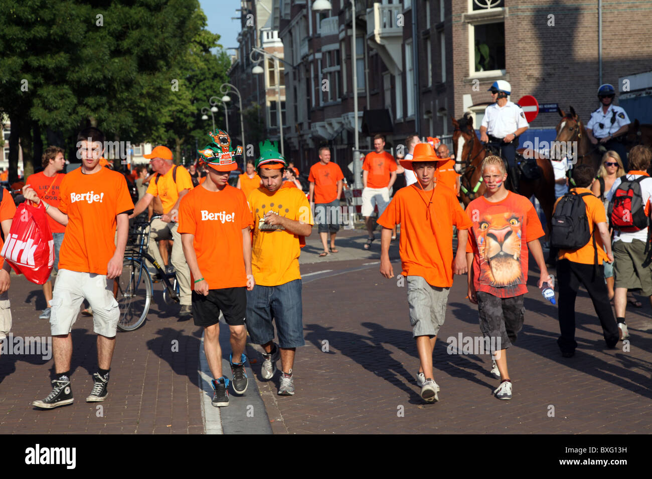 Football fans walking down road hi-res stock photography and images - Alamy