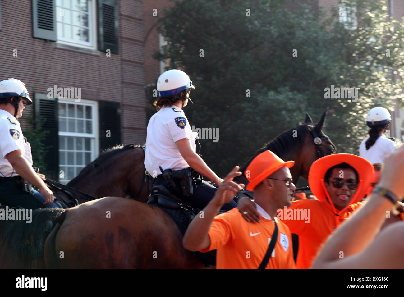 Police watching the crowd of football fans in Amsterdam just before the ...