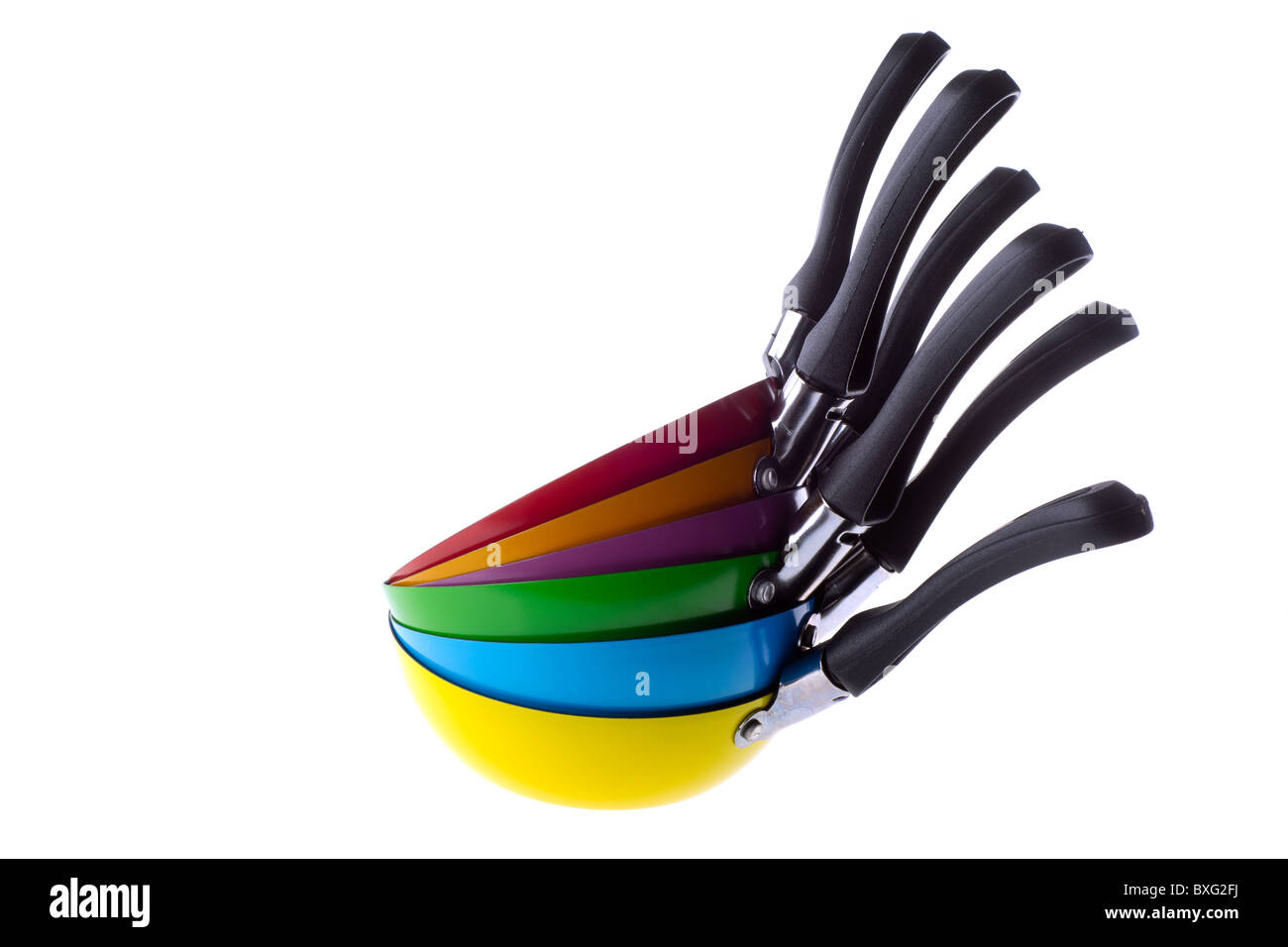 Many stacked colorful frying pans isolated over white Stock Photo - Alamy