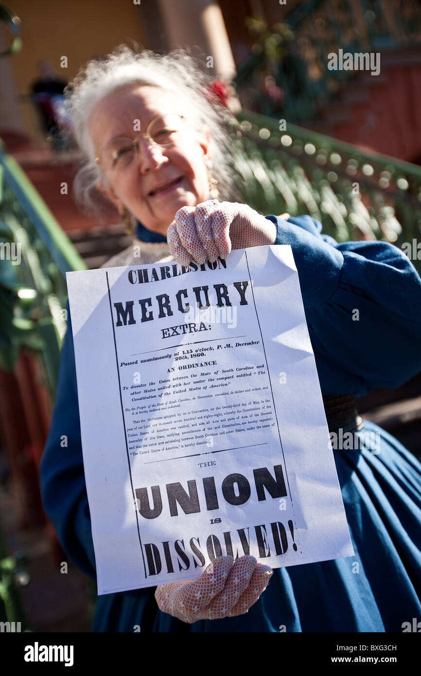 June Murray Wells, Director of the Confederate Museum holds a copy of ...