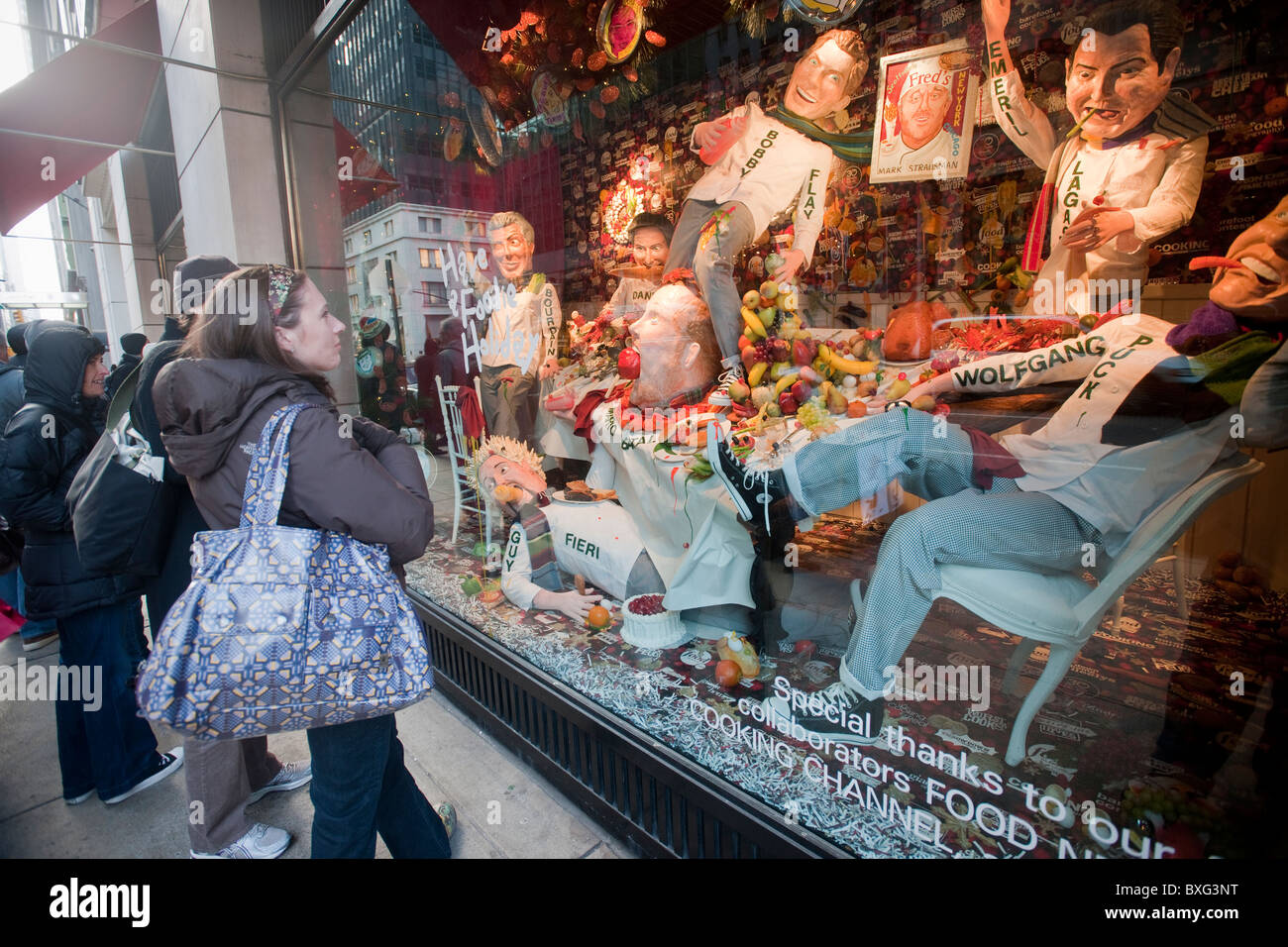 Passer-by view the Barney's Christmas window display Stock Photo - Alamy