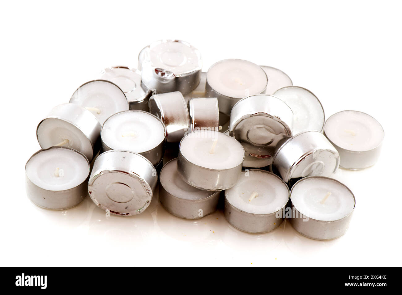 Pile of new little candles isolated over white background Stock Photo ...
