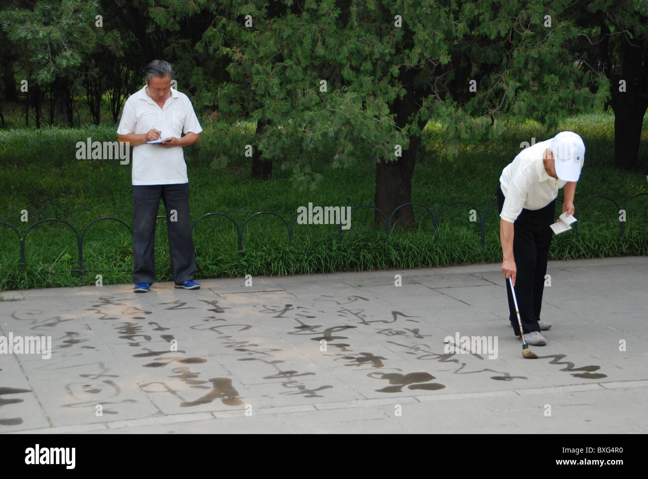 Calligraphy on Pavement, Park, Beijing, China Stock Photo - Alamy